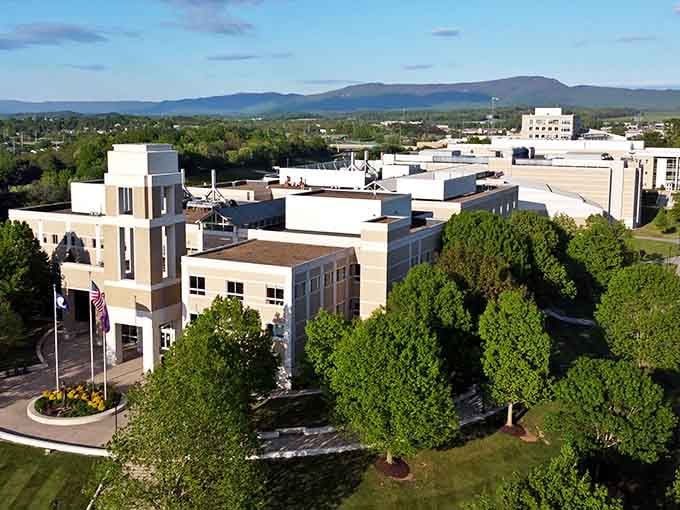 Mountains frame this modern campus like nature's own amphitheater, creating views that make studying almost seem appealing.