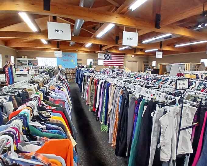 Inside those wooden beams, endless rows of organized clothing await discovery—like a department store designed by country carpenters.