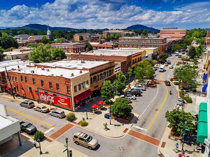 Mountains embrace this downtown where that vintage Coca-Cola sign reminds you some classics never go out of style.