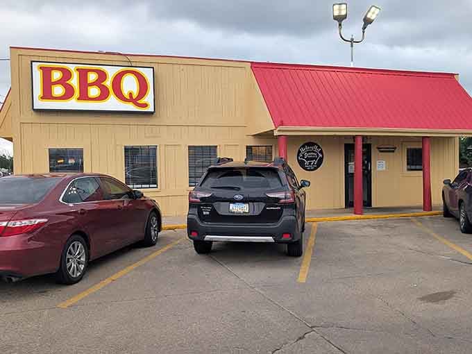 That bold BBQ sign is all the advertising Hickory Hut needs. The parking lot's full for a reason!