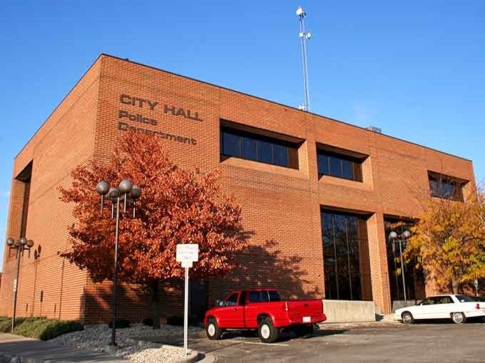 Kokomo's City Hall stands proudly against a brilliant blue sky. Red brick and autumn trees&mdash;a perfect match that would make Bob Ross reach for his happy little brushes!