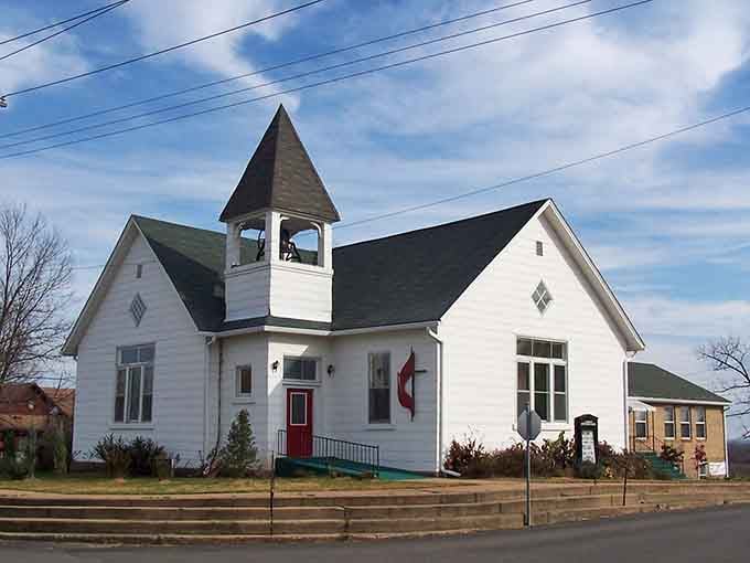 This charming white church with its bell tower looks like it belongs on a Christmas card celebrating small-town values.