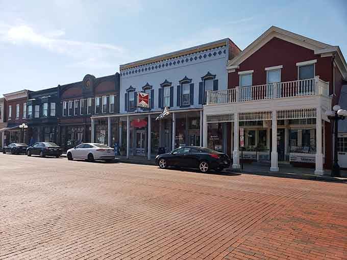 Brick storefronts line up like dominoes, each one preserving a piece of Main Street America that shopping malls tried erasing.