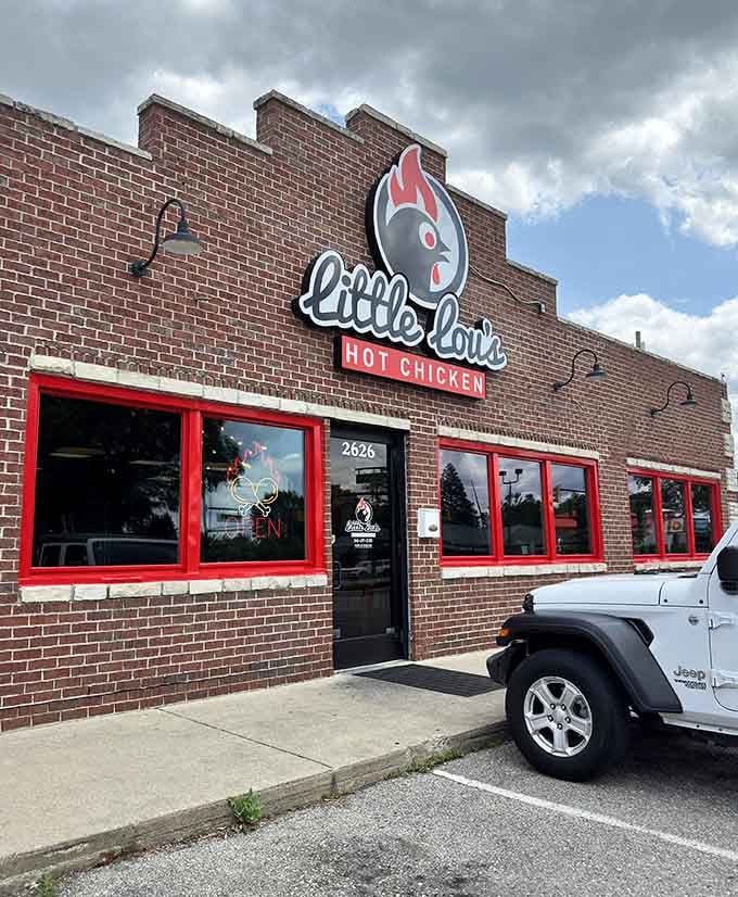 Those bright red windows aren't just for show—they're warning signs for the delicious heat that awaits inside Little Lou's.