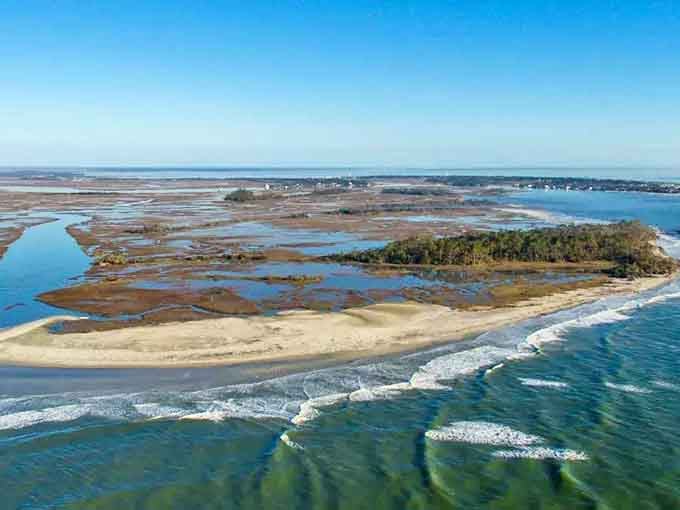 The intricate dance of land and water creates a coastal masterpiece that changes with every tide and season.