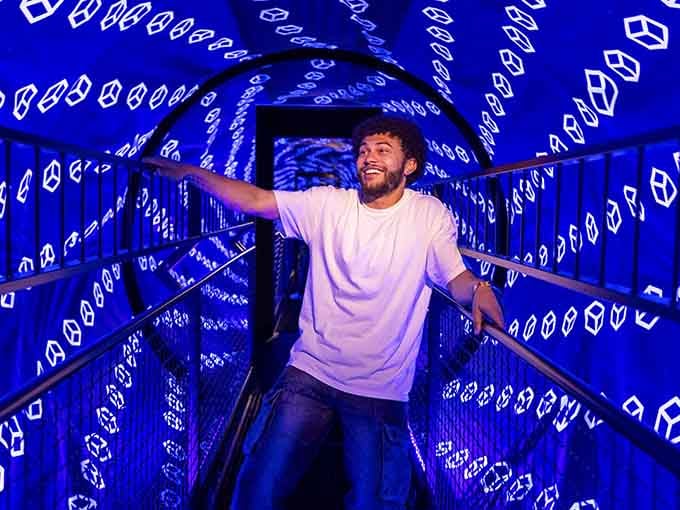 The glowing blue tunnel seems to stretch into infinity, perfectly capturing how illusions can completely fool us.