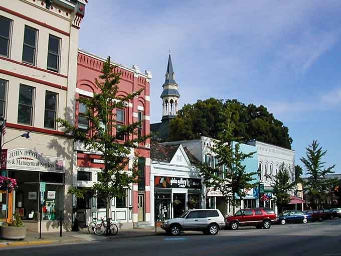 That church steeple pierces the sky like a white exclamation point, visible from every corner of this picturesque town.