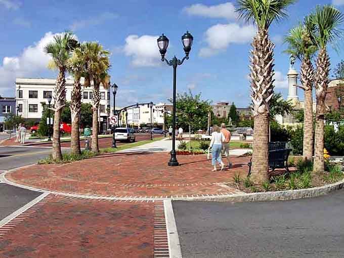 Palm trees sway over brick plazas where neighbors gather and retirement budgets stretch further than expected.