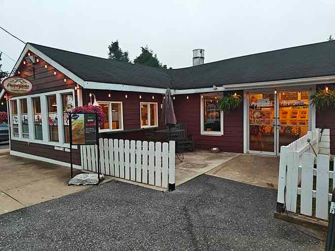 String lights glowing at dusk transform this cozy spot into an evening destination for sandwiches that satisfy beyond expectations.