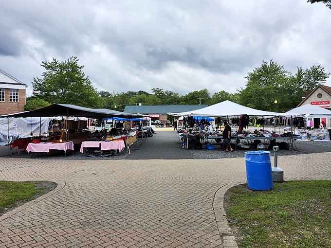 Storm clouds gather overhead but determined shoppers keep browsing under protective tents, undeterred by Mother Nature's mood.