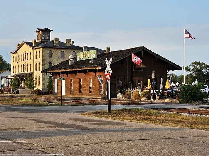 Historic depot buildings meet modern life where trains once brought travelers to this riverside community's welcoming embrace.