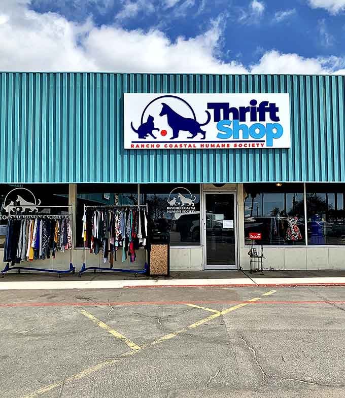 Clothing racks spill onto the sidewalk like appetizers before the main course of treasures waiting inside.