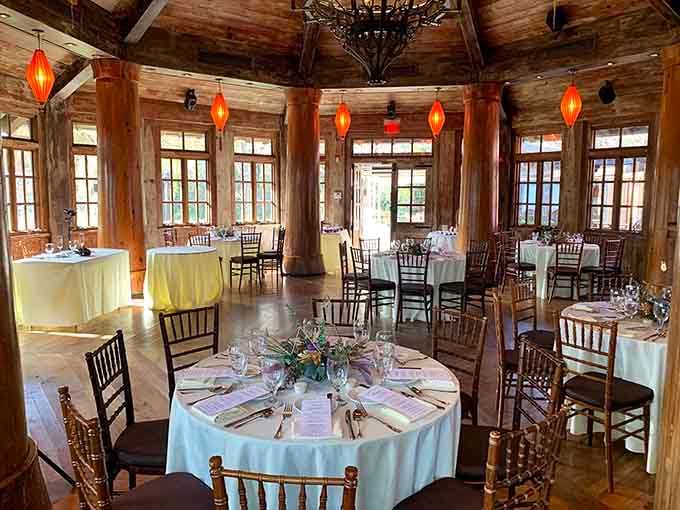 Soaring wooden beams and glowing lanterns create an elegant space that feels both rustic and remarkably refined.