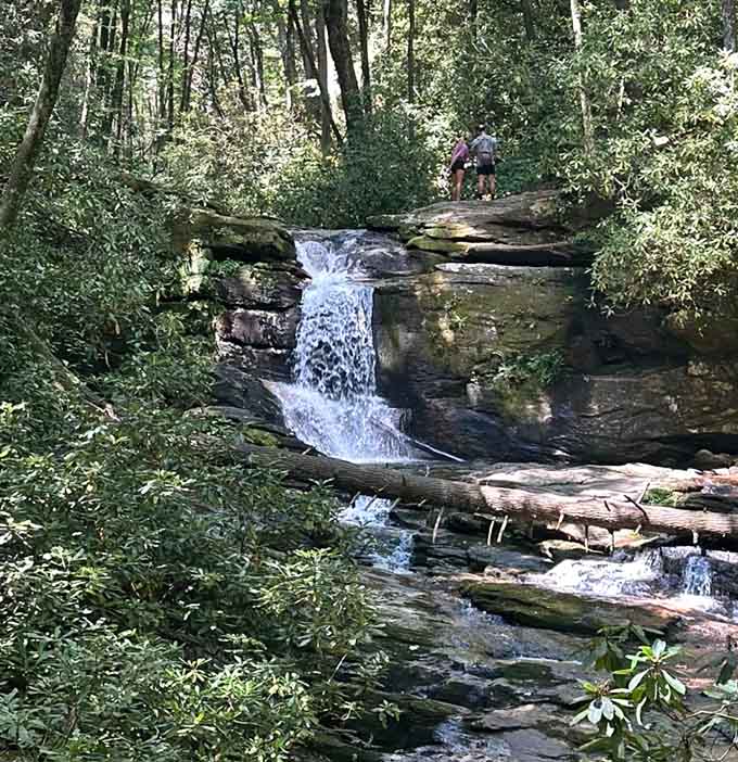 Hikers perched above Raven Cliff Falls discover that the best views in life require a bit of climbing and sensible footwear.