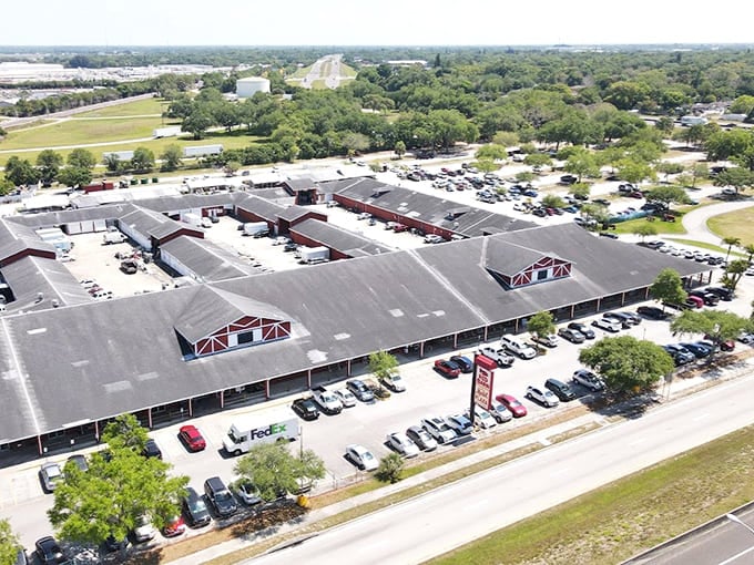 Those distinctive red barn-style roofs shelter enough vendors to keep you browsing until closing time arrives.
