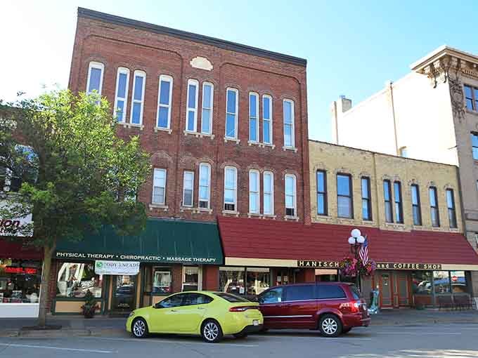 Awnings and ornate brickwork give this downtown corner more character than most modern shopping malls combined.