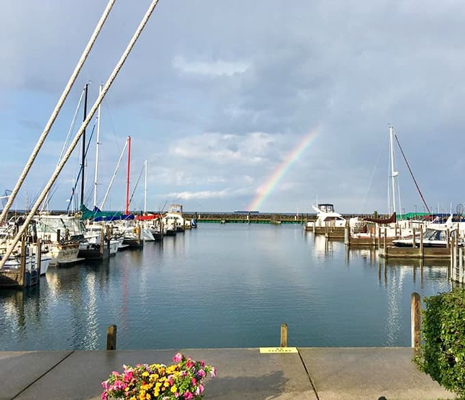 Mother Nature painted a rainbow over this harbor, as if the sailboats and flowers weren't already picture-perfect enough.