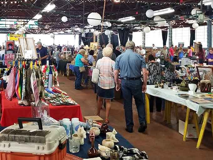 Twinkling lights overhead create a festive atmosphere where antiques and handmade crafts share equal billing.