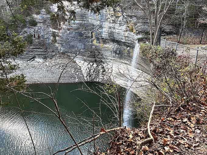 From above, the emerald pool gleams like a precious gem tucked between ancient stone walls.