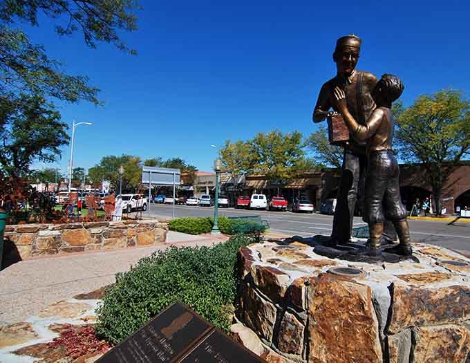 This bronze statue honors the town's heritage, standing proudly where community values still mean something tangible and real.