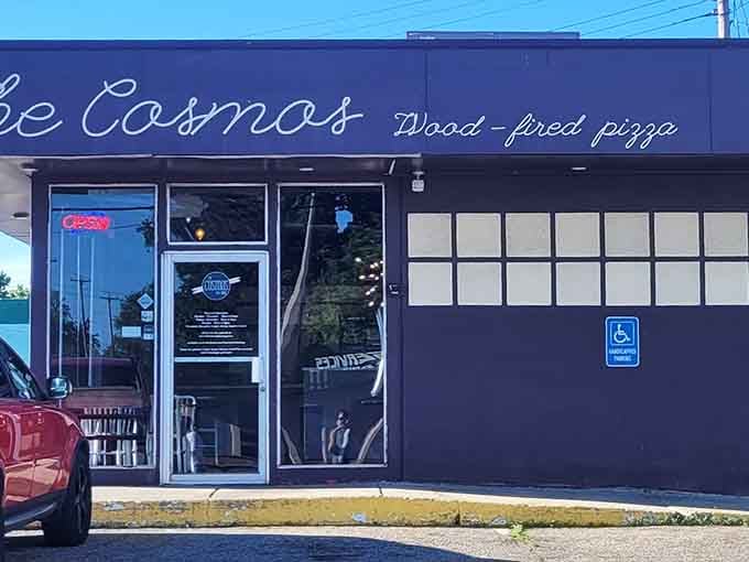 "Wood-fired pizza" – three simple words on The Cosmos' façade that translate to "get in here now" for pizza lovers.