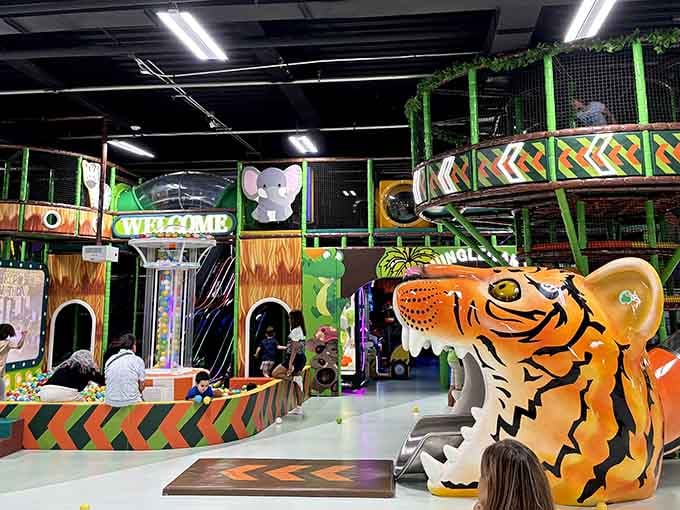 The jungle-themed play structure rises up like a safari adventure condensed into one magnificent indoor playground.