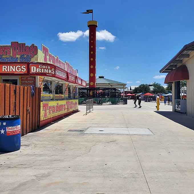 The red tower stands tall like a lighthouse guiding treasure hunters to their weekend shopping destination below.
