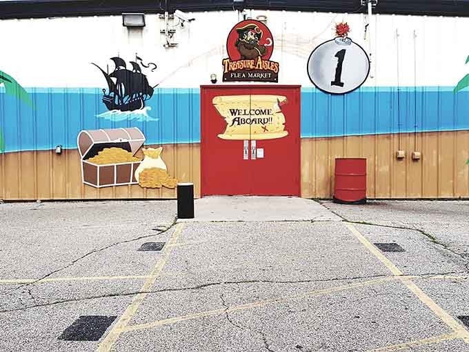That pirate-themed entrance promises adventure, complete with treasure chest and "Welcome Aboard" greeting for shoppers.