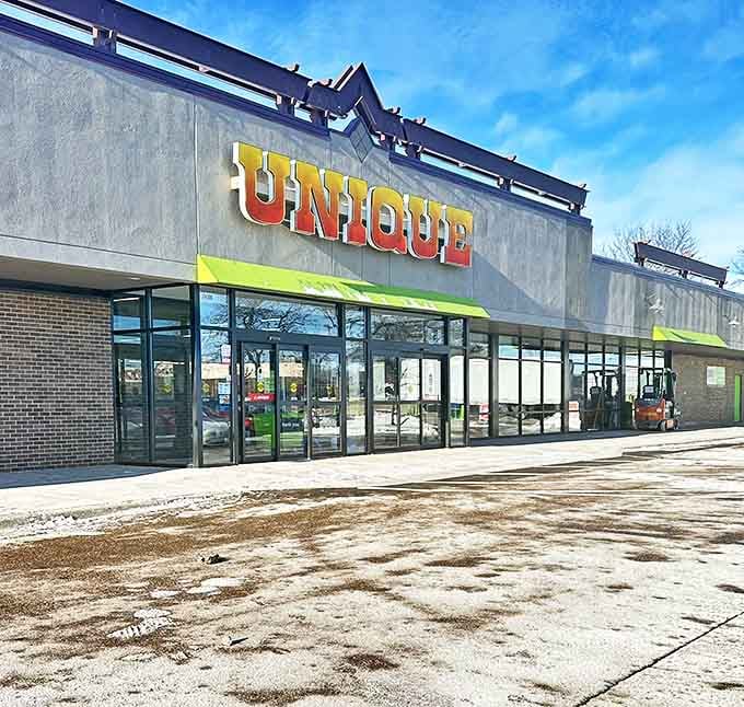 The Unique sign glows against Minnesota's blue sky. A portal to a world where yesterday's trends become tomorrow's vintage finds.