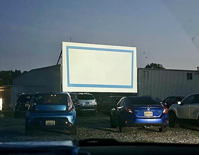 The blue-framed screen awaits its nightly transformation from blank canvas to window into another world entirely.