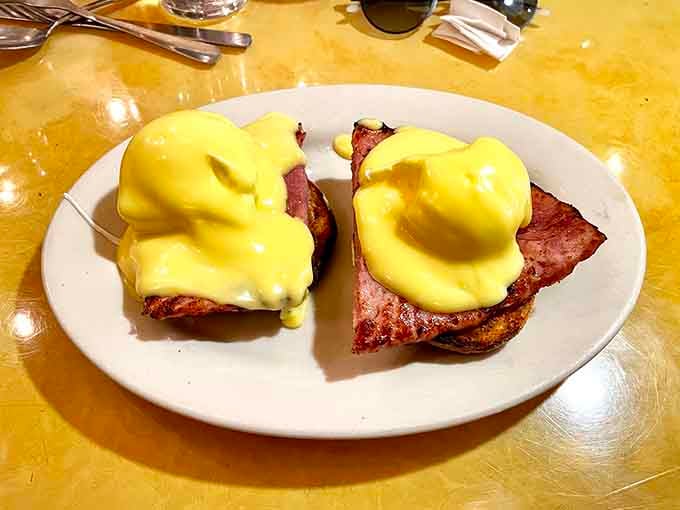 Eggs Benedict at Al's means perfectly poached eggs draped in hollandaise over Canadian bacon, breakfast luxury on a plate.