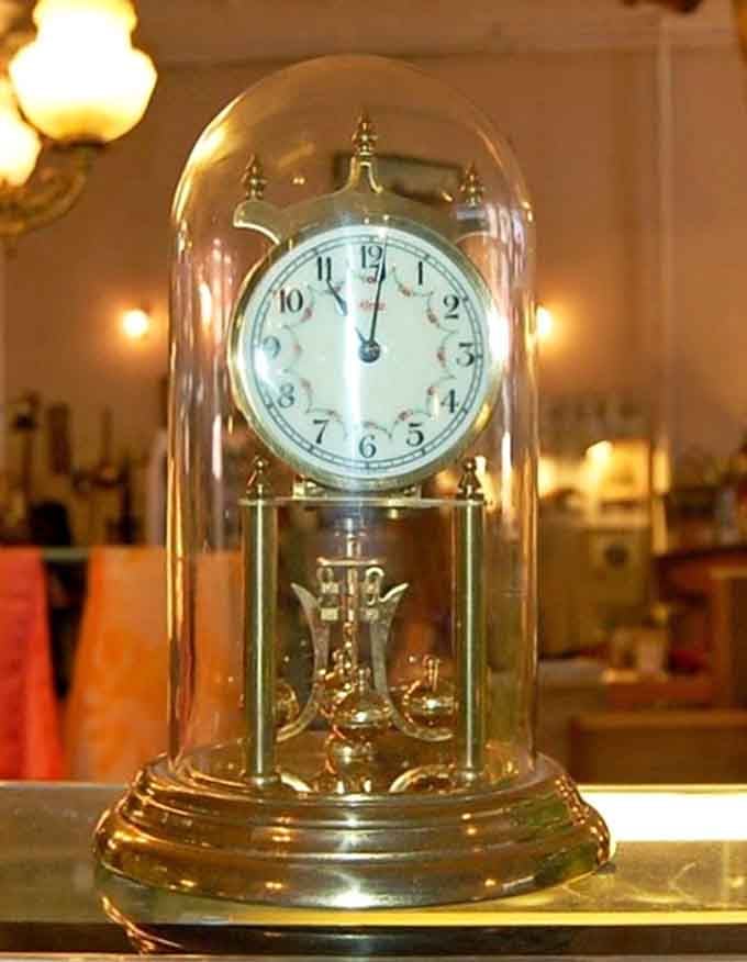 This anniversary clock under glass doesn't just tell time&mdash;it's a mechanical ballet that's been dancing for generations.