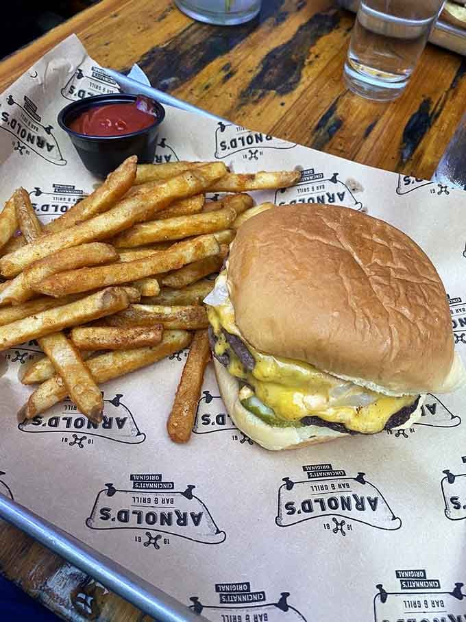 The classic burger and fries combo that's been perfecting itself for generations, served on paper for authenticity.
