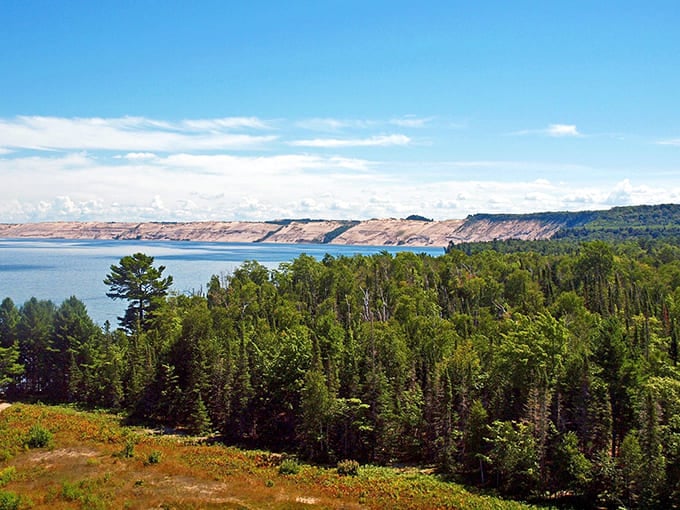 The Grand Sable Dunes visible from the lighthouse create a desert-meets-lake landscape that shouldn't exist but does.