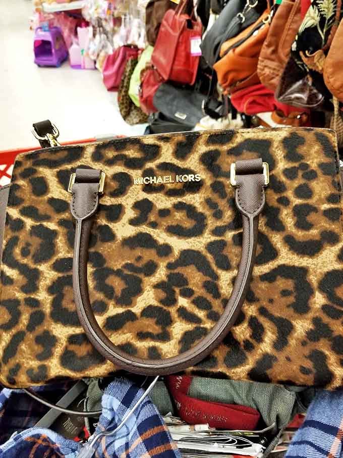 That leopard-print Michael Kors hiding among everyday handbags? The thrift equivalent of finding a twenty in your winter coat pocket.