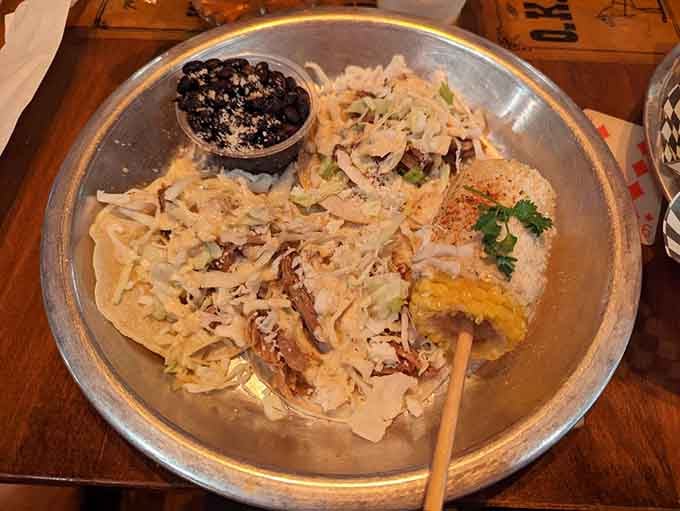 Street tacos piled high with carnitas, proving that even historic saloons know good Mexican food when they taste it.