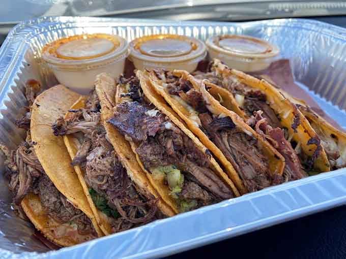 These tacos aren't just filled; they're loaded with barbacoa that's been flirting with smoke for hours. The tortillas are just along for the ride.