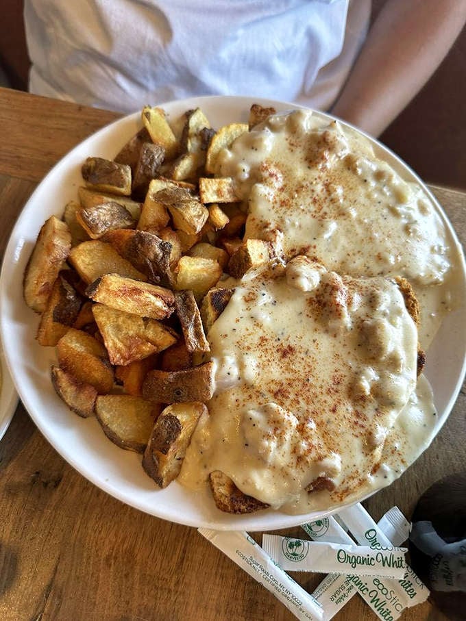 Biscuits and gravy: where golden-brown potatoes meet creamy, peppery gravy in a breakfast romance that would make Shakespeare weep.