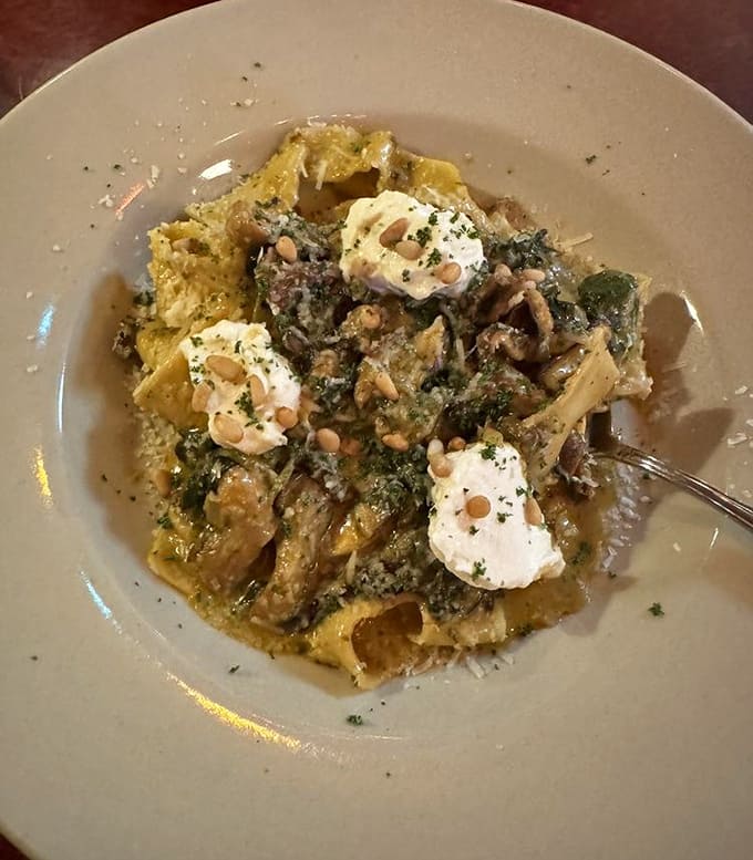 Homemade pasta topped with fresh burrata, because apparently this tiny tavern decided ordinary just wasn't in their vocabulary.