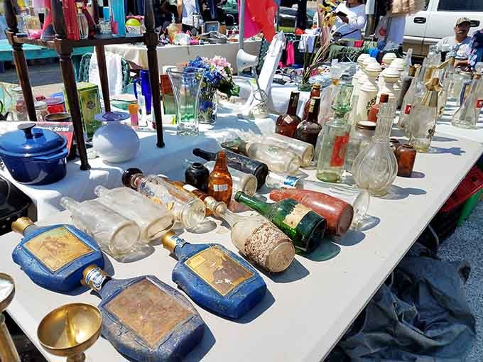 Vintage bottles lined up like they're auditioning for an antique roadshow, each one holding stories from decades past.