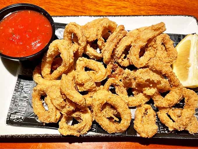 Crispy calamari that shatters like glass when bitten, paired with marinara that tastes like someone's Italian grandmother is hiding in the kitchen.