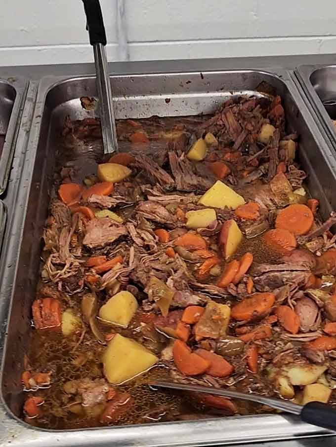 Pot roast swimming with carrots and potatoes in a broth that probably tastes like a warm Southern hug.