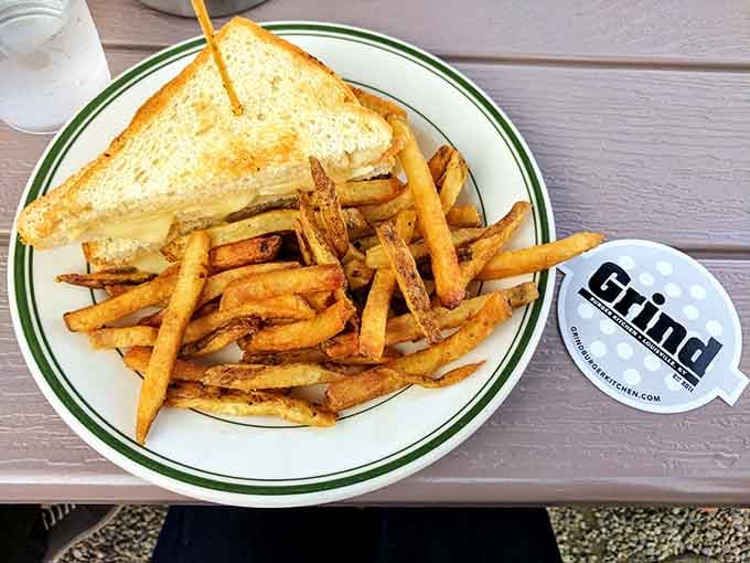 This grilled cheese isn't kidding around. Golden, buttery bread embracing a molten cheese center with those twice-fried fries standing guard.