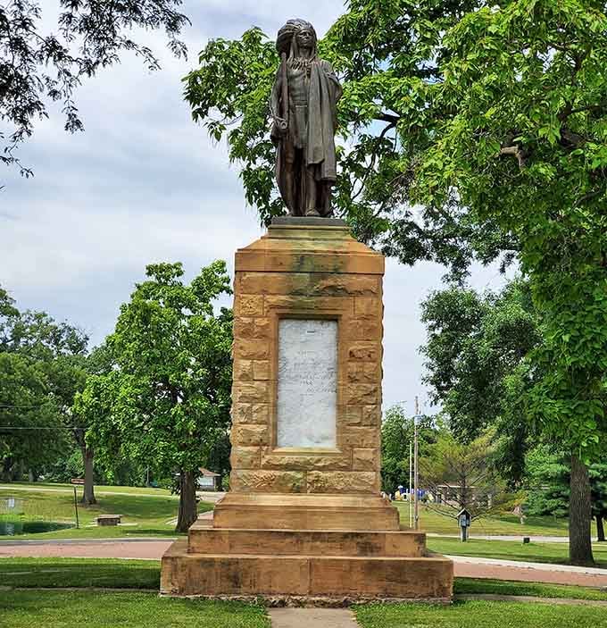 The Chief Keokuk Monument stands tall among the trees, a dignified tribute that connects visitors to the rich indigenous history that shaped this river town.