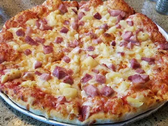 Ham and pineapple pizza done right, because even controversial toppings deserve respect when executed with care and quality ingredients.