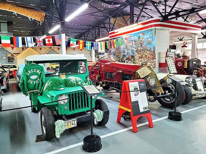 Car enthusiasts, your happy place awaits! The City Garage Museum showcases vintage vehicles including this spirited green "Greene Devils" jeep that's ready to rally.