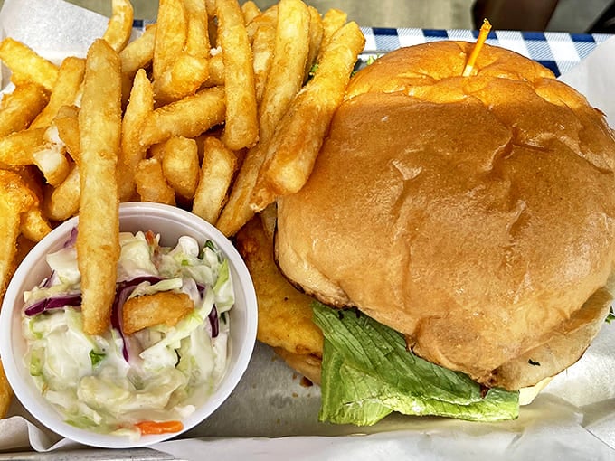 This isn't just a sandwich; it's an edible love letter to Alaska's waters. The coleslaw adds crunch while the fries stand at attention, ready for duty.