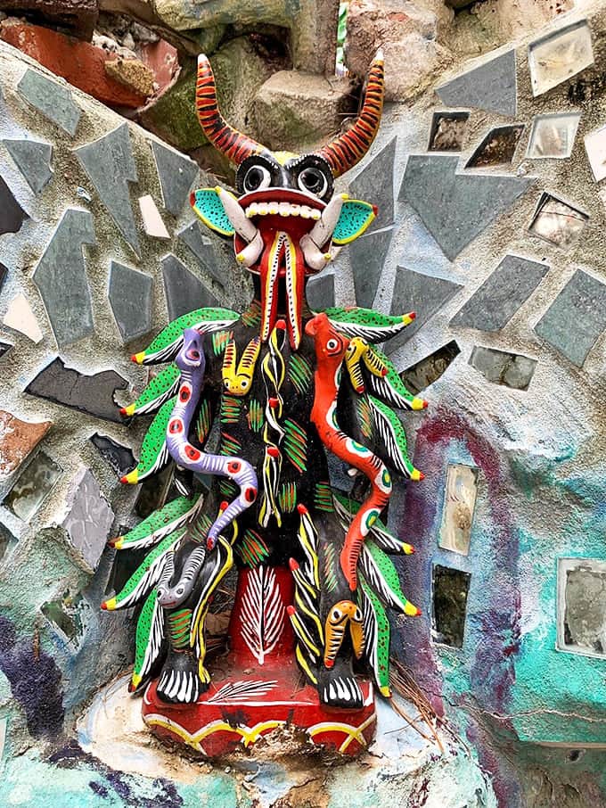 Not your garden-variety garden ornament! This vibrant creature looks like it escaped from someone's wildest fever dream&mdash;in the best possible way.