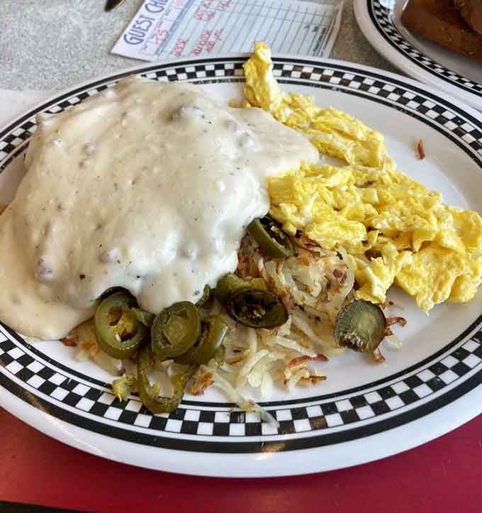 This isn't just breakfast&mdash;it's edible therapy. White gravy blankets everything like fresh Missouri snow, turning comfort food into an art form.