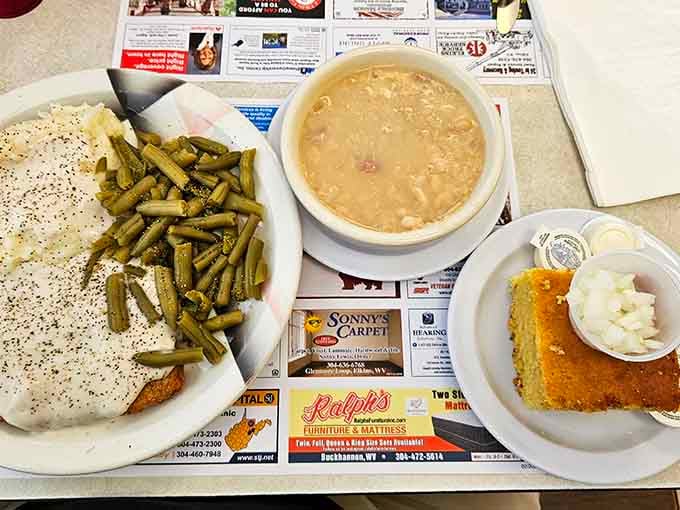 Country fried steak swimming in gravy with green beans that actually taste like vegetables, not just salt—a true Appalachian miracle.